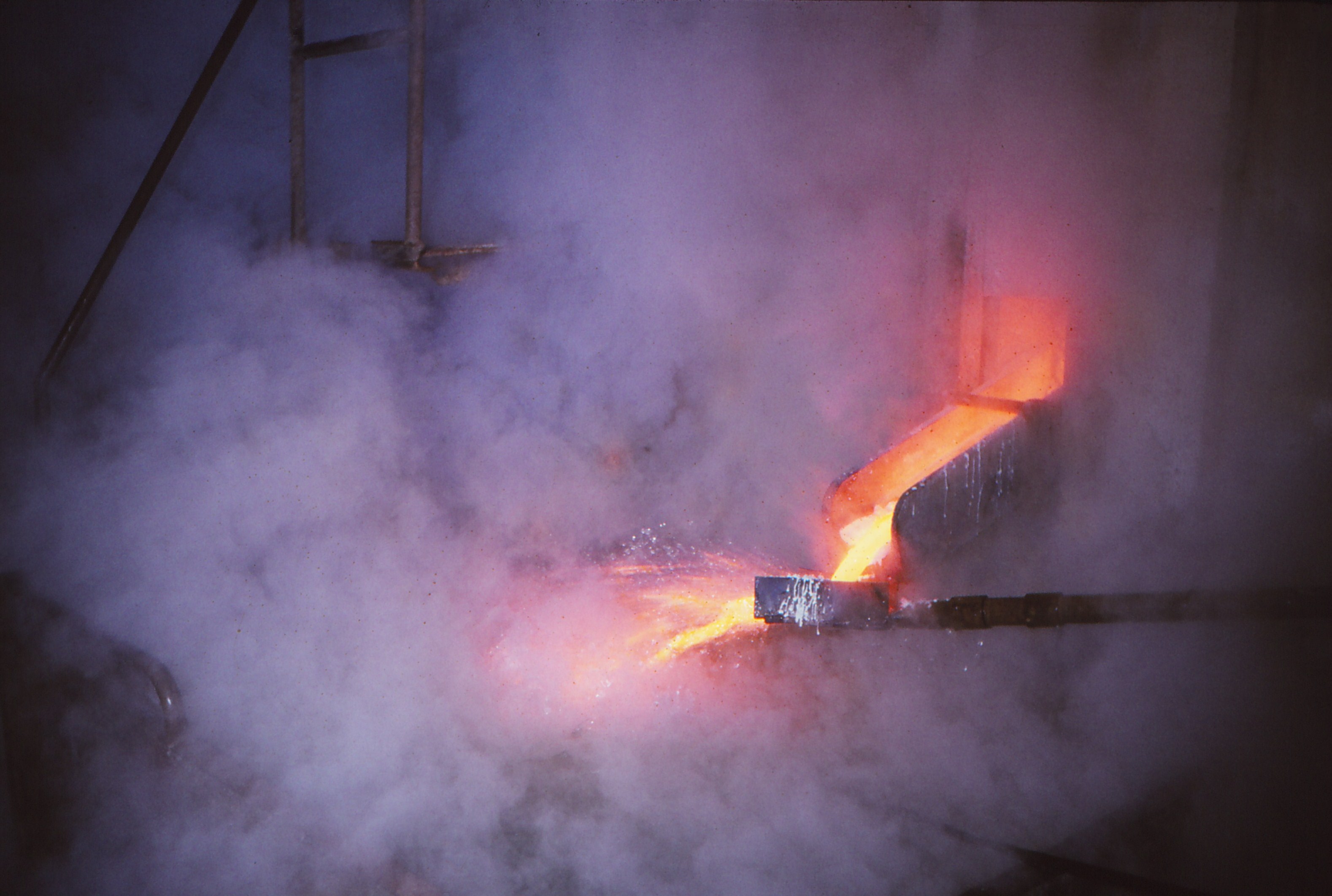 Running molten frit into cold water